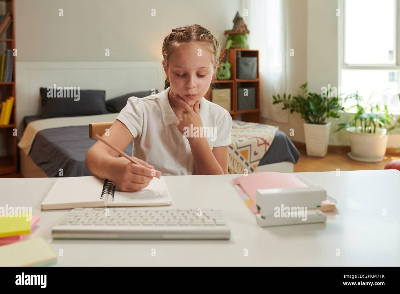 Child solving equation book hi-res stock photography and images - Alamy