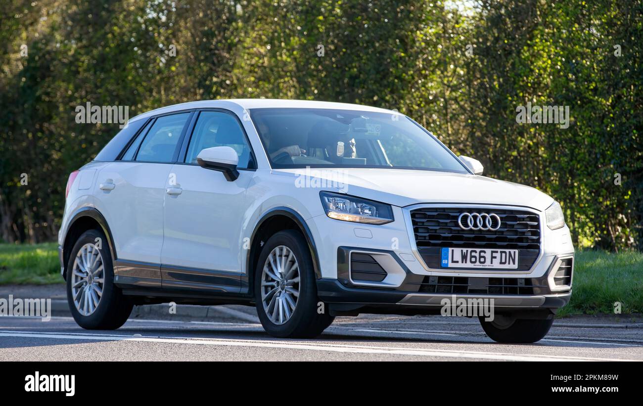 2017 white diesel engine Audi Q2 car travelling on an English country ...