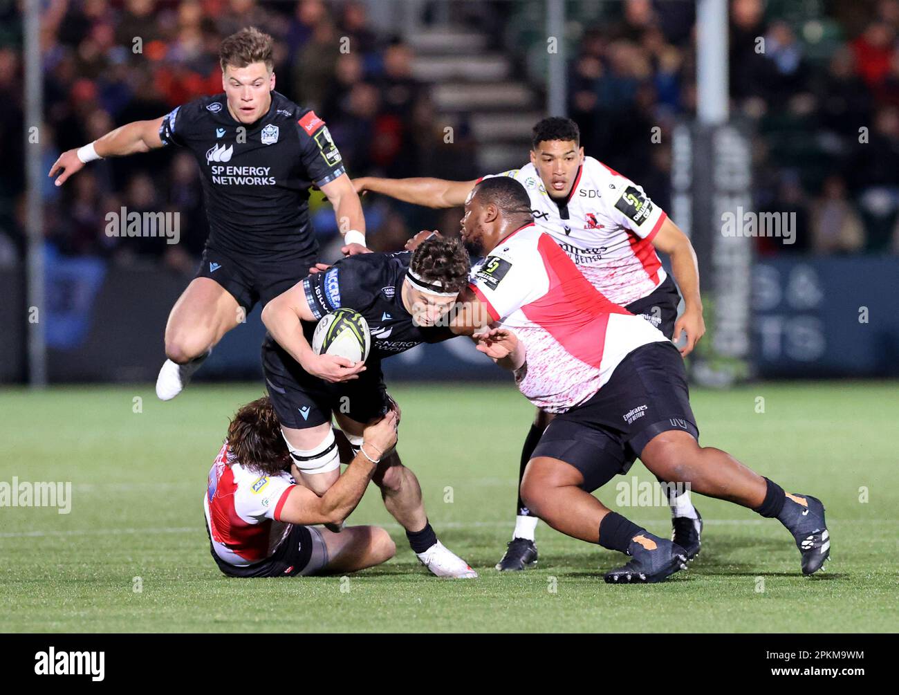 Glasgow Warriors' Rory Darge is tackled by Emirates Lions' Asenathi ...