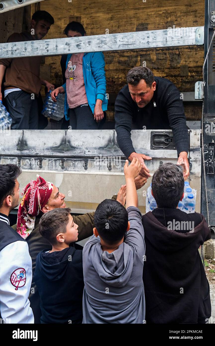 Hatay, Turkey. 08th Apr, 2023. People are seen struggling to get water ...