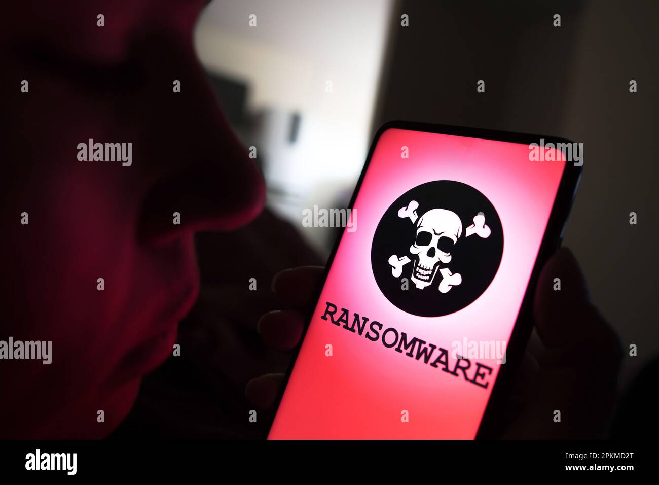 In this photo illustration, the person holds a smartphone with a ...