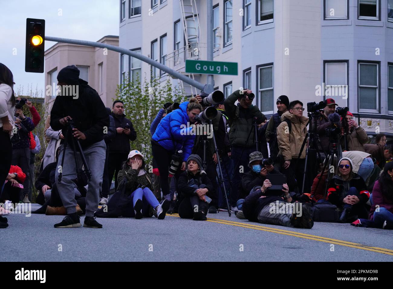 People take photos of sunrise in the middle of the road. The rising sun ...
