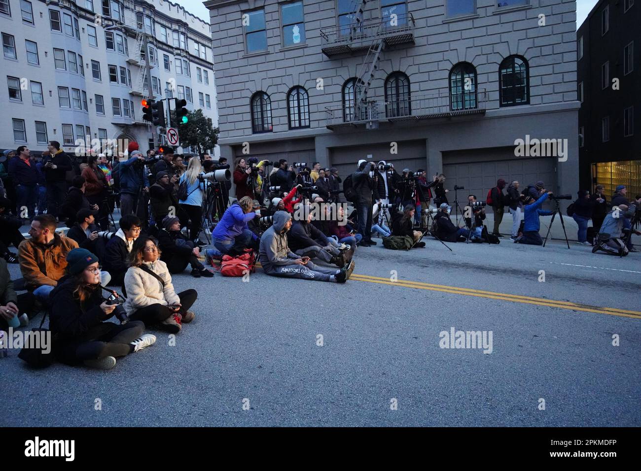 People take photos of sunrise in the middle of the road. The rising sun ...