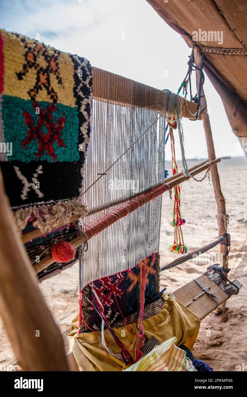A weaving loom set up in the desert near Merzouga Morocco Stock Photo ...