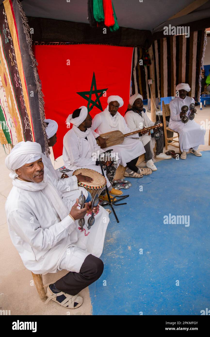 A group of Moroccan men perform music at Dar Gnaoua Bambara Khamlia ...