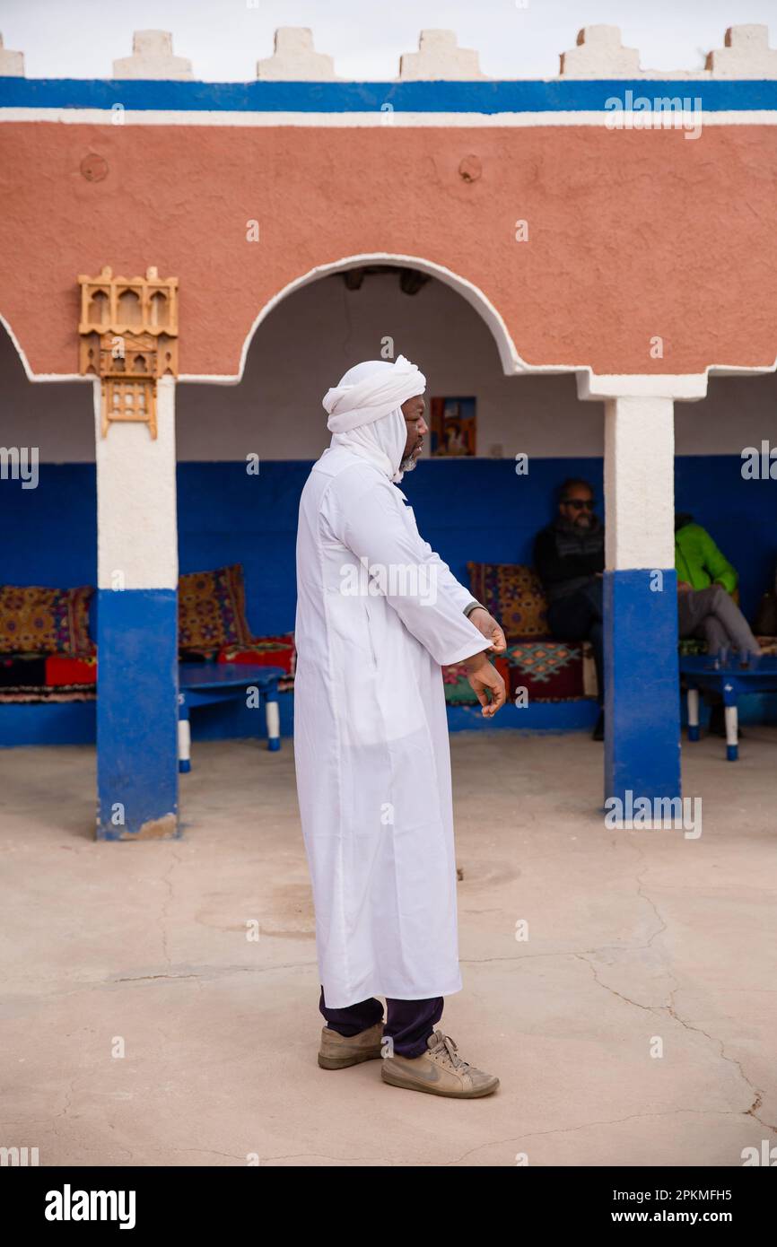A Moroccan man in traditional clothing at the Dar Gnaoua Bambara ...