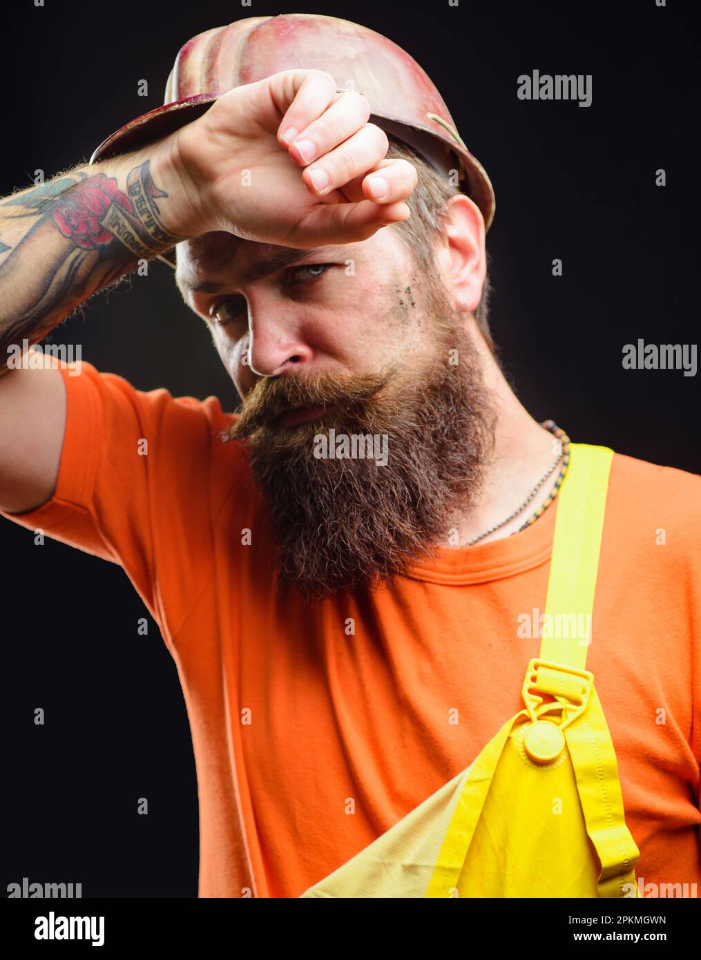 Construction worker in safety helmet. Builder in overalls and hardhat ...