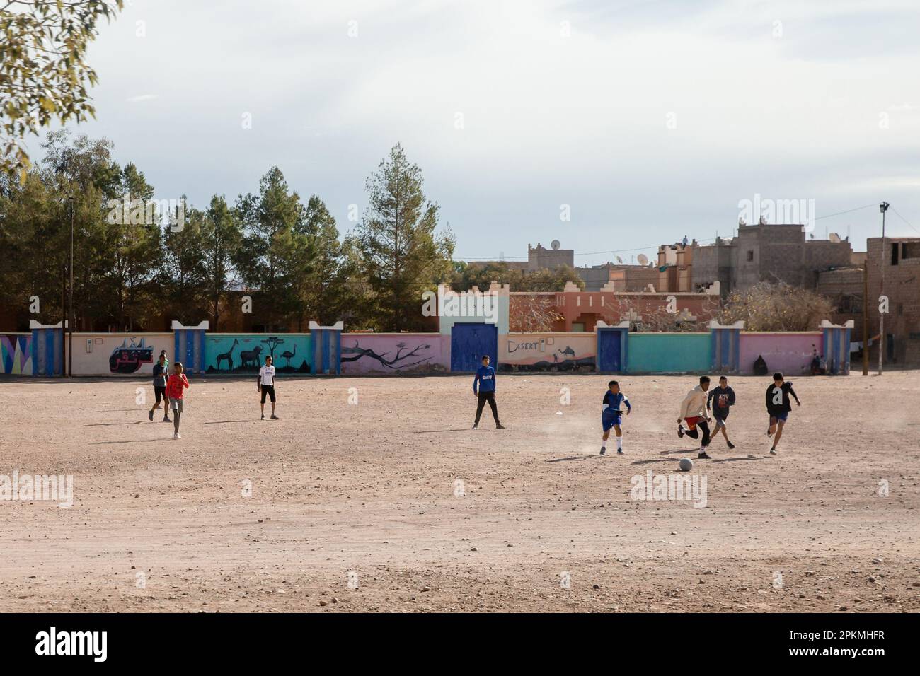 A group of Moroccan boys play soccer on a dirt field Stock Photo - Alamy