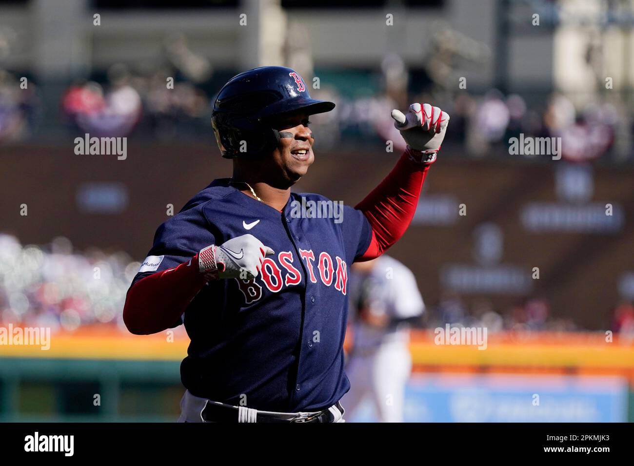 Boston Red Sox's Rafael Devers approaches the dugout after hitting a ...