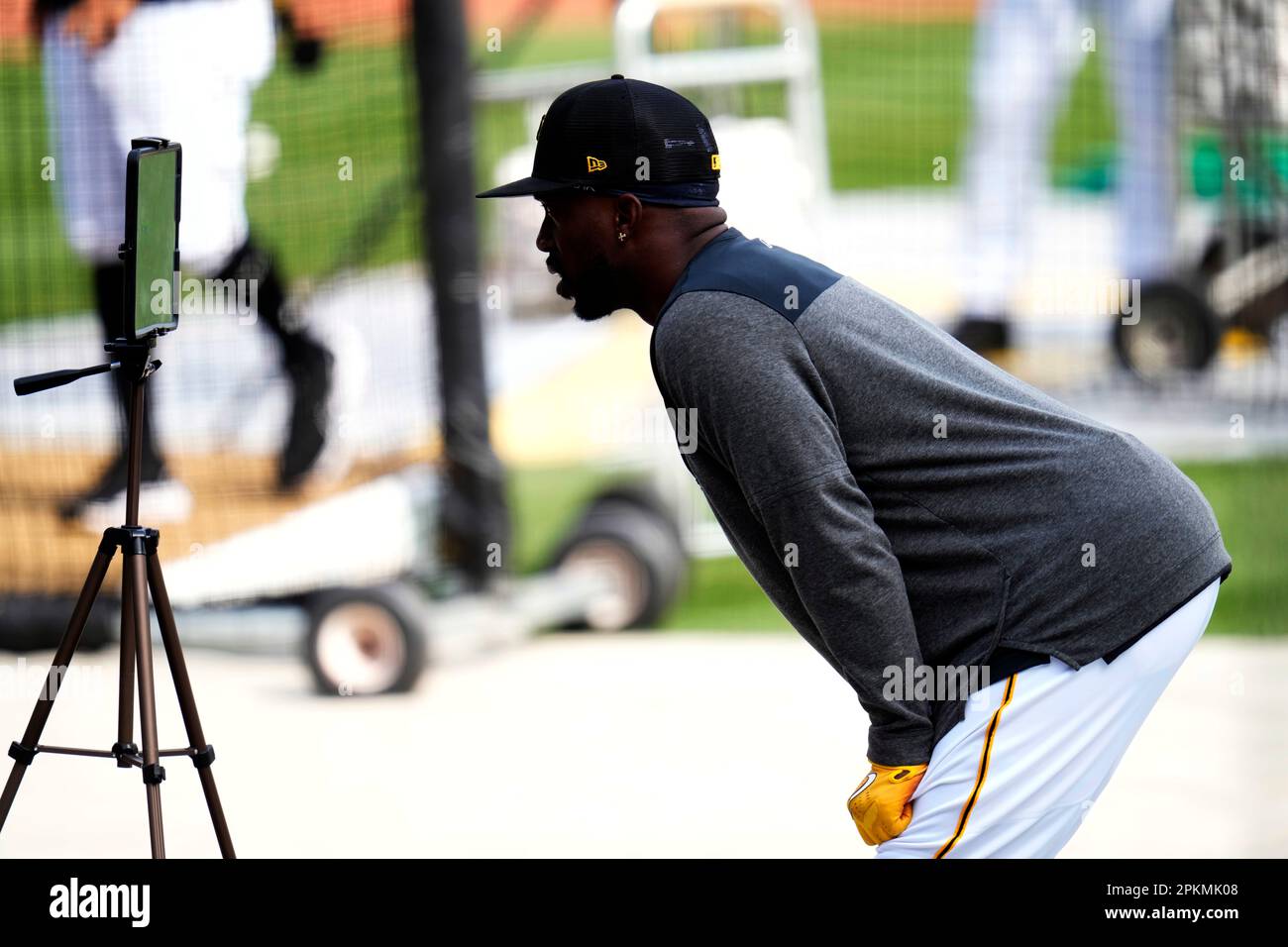 Pittsburgh Pirates' Andrew McCutchen watches video of his turn in the ...