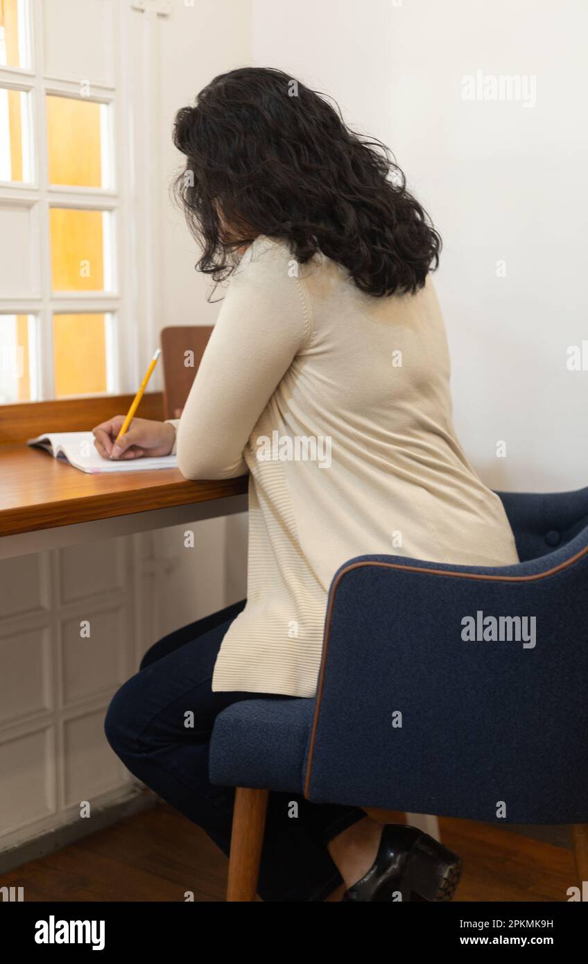 busy sitting on her back a young latina woman with glasses and short ...