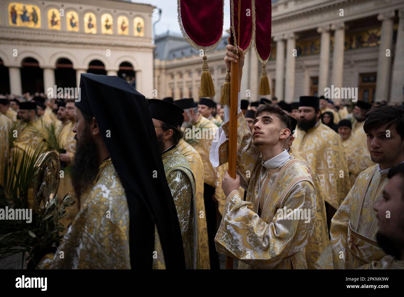 A young cleric looks up as Romanian Orthodox priests and believers ...
