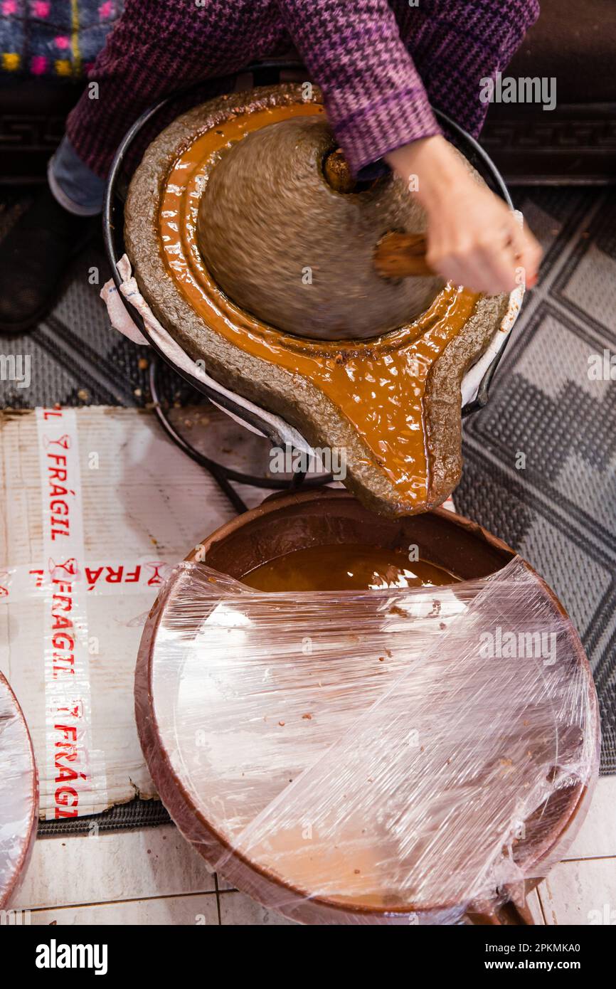 Cold pressing Argan kernels to make Argan Oil in Morocco Stock Photo ...