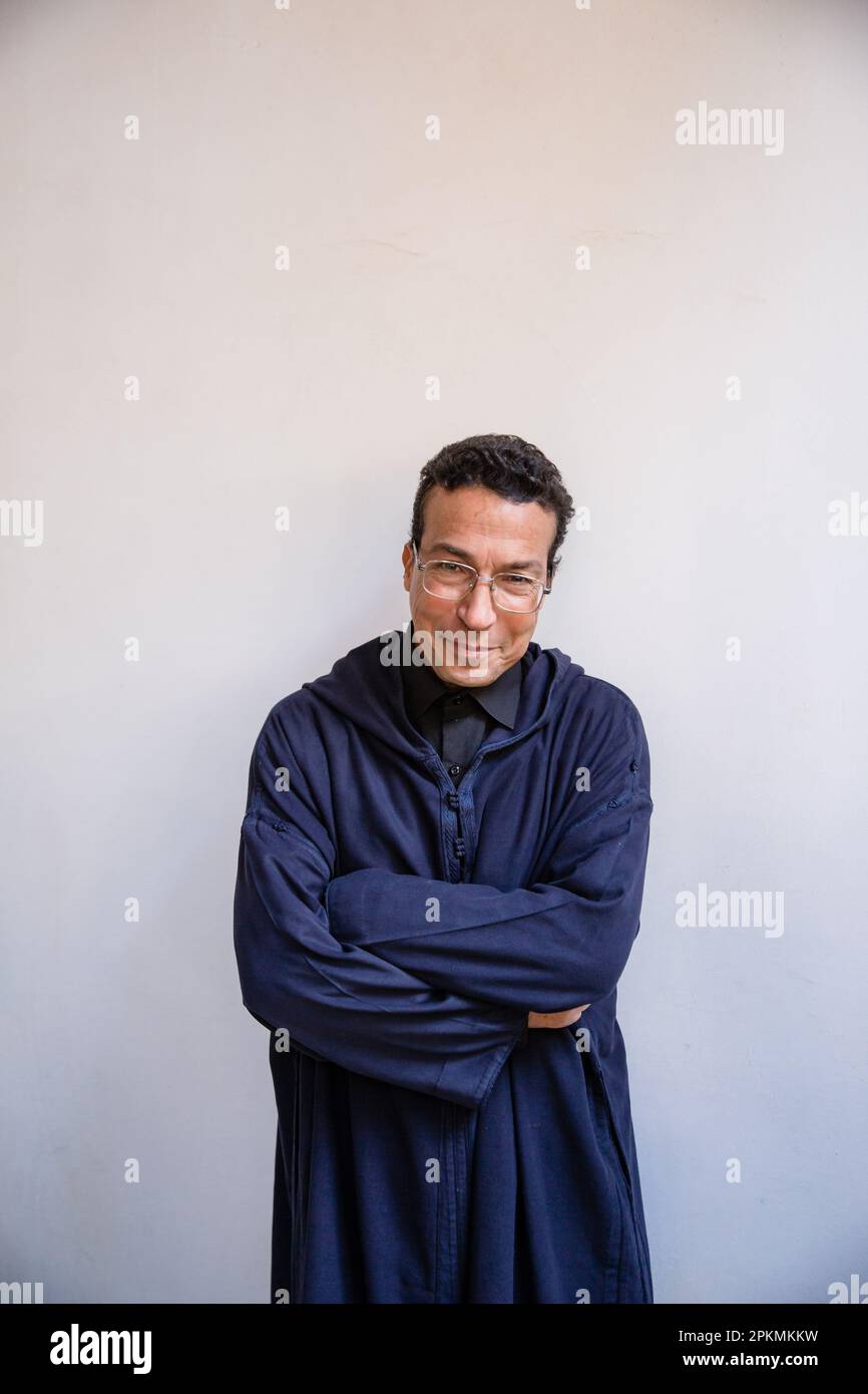 A Moroccan tour guide poses for a photo at Bahia Palace in Marrakech ...