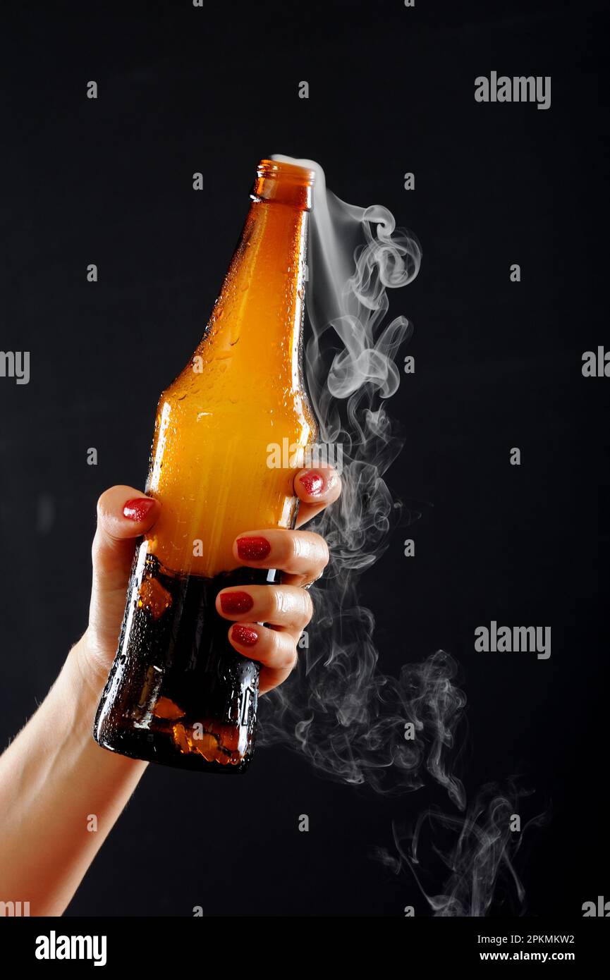 Hand holding glass bottle beer alcohol hi-res stock photography and ...