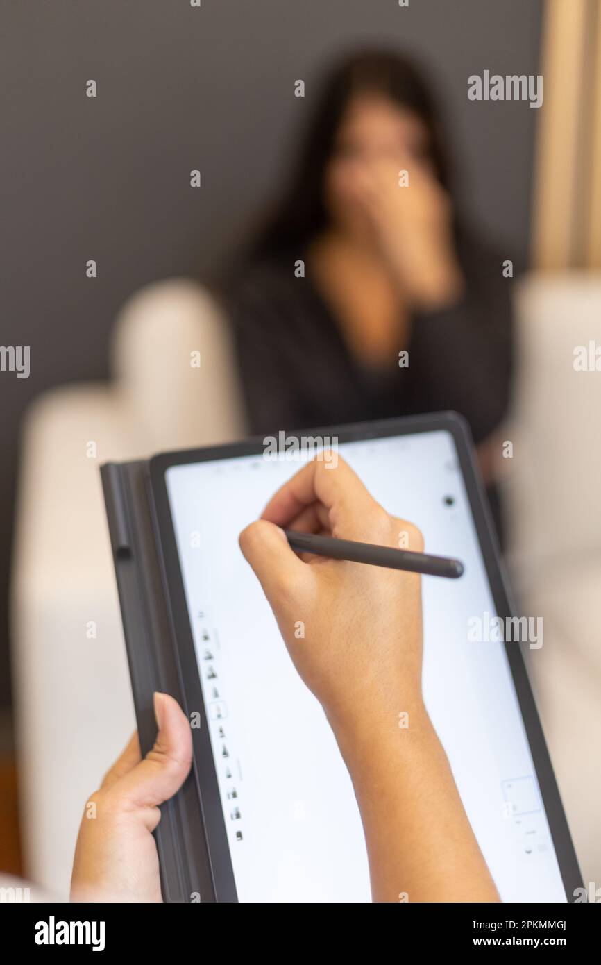 details of a tablet, writing on the screen of a digital device ...