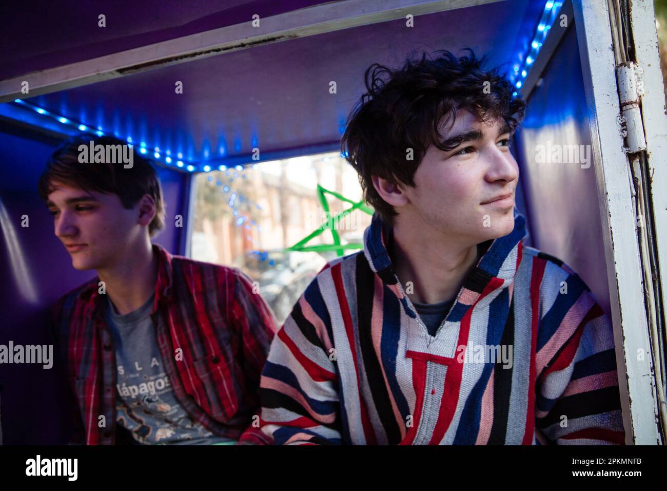American teen boy tourists looking out during their tuk tuk tour Stock ...