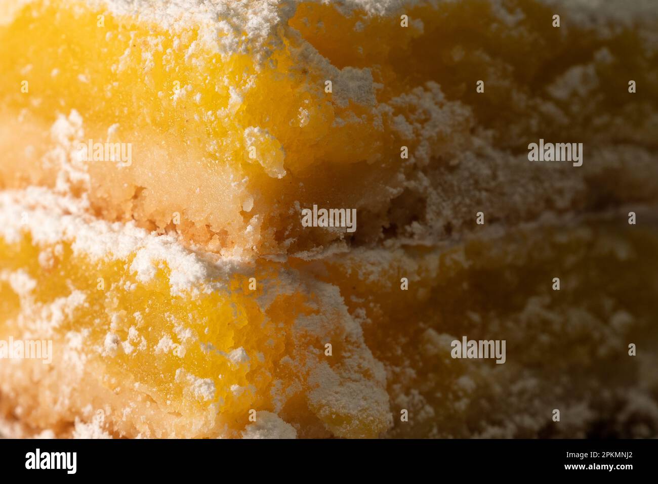 100mm Macro lens close-up Lemon Bar double layered with sweet yellow ...