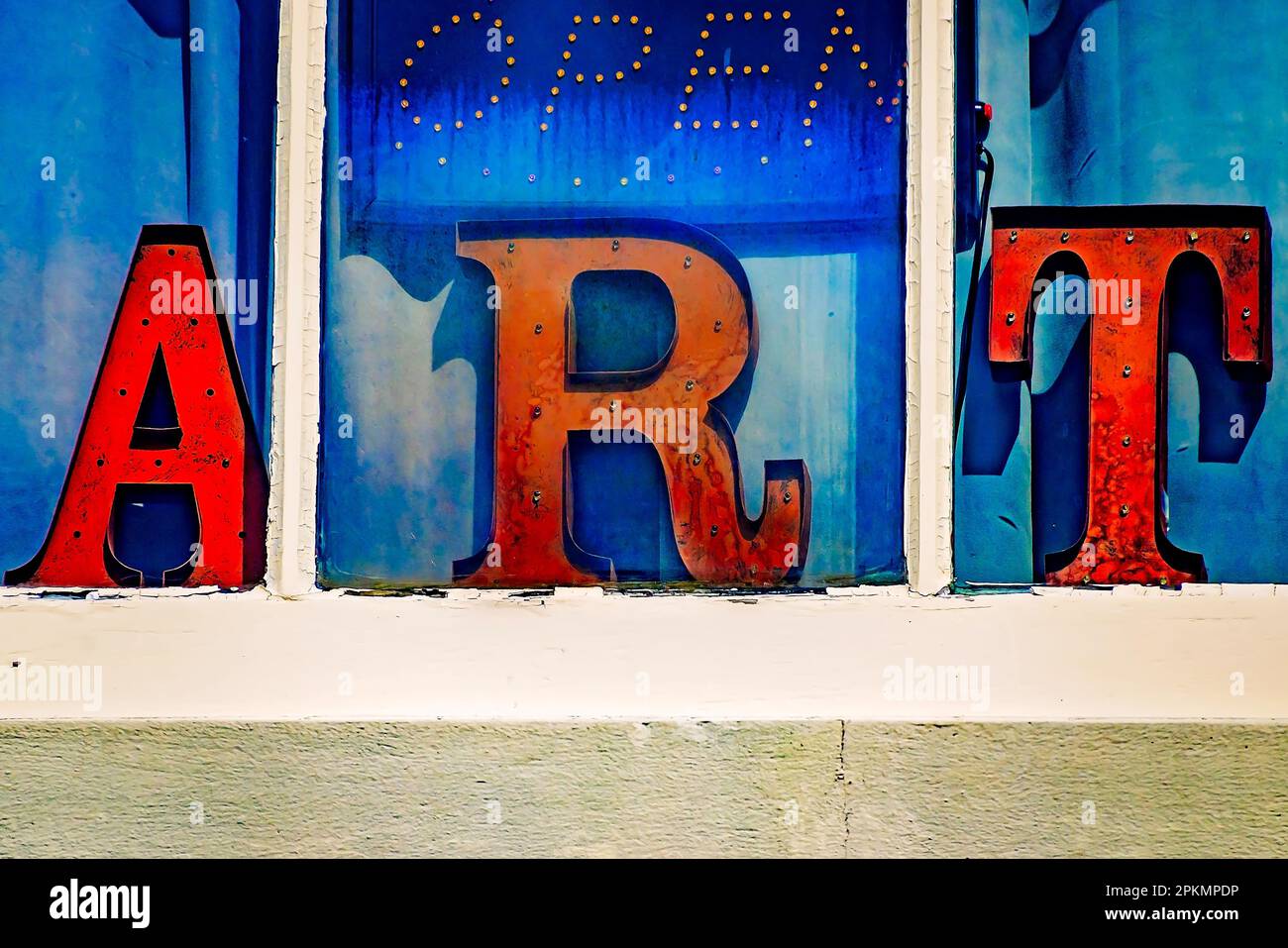A sign advertising art hangs in the window of Gulfport Arts Center in ...