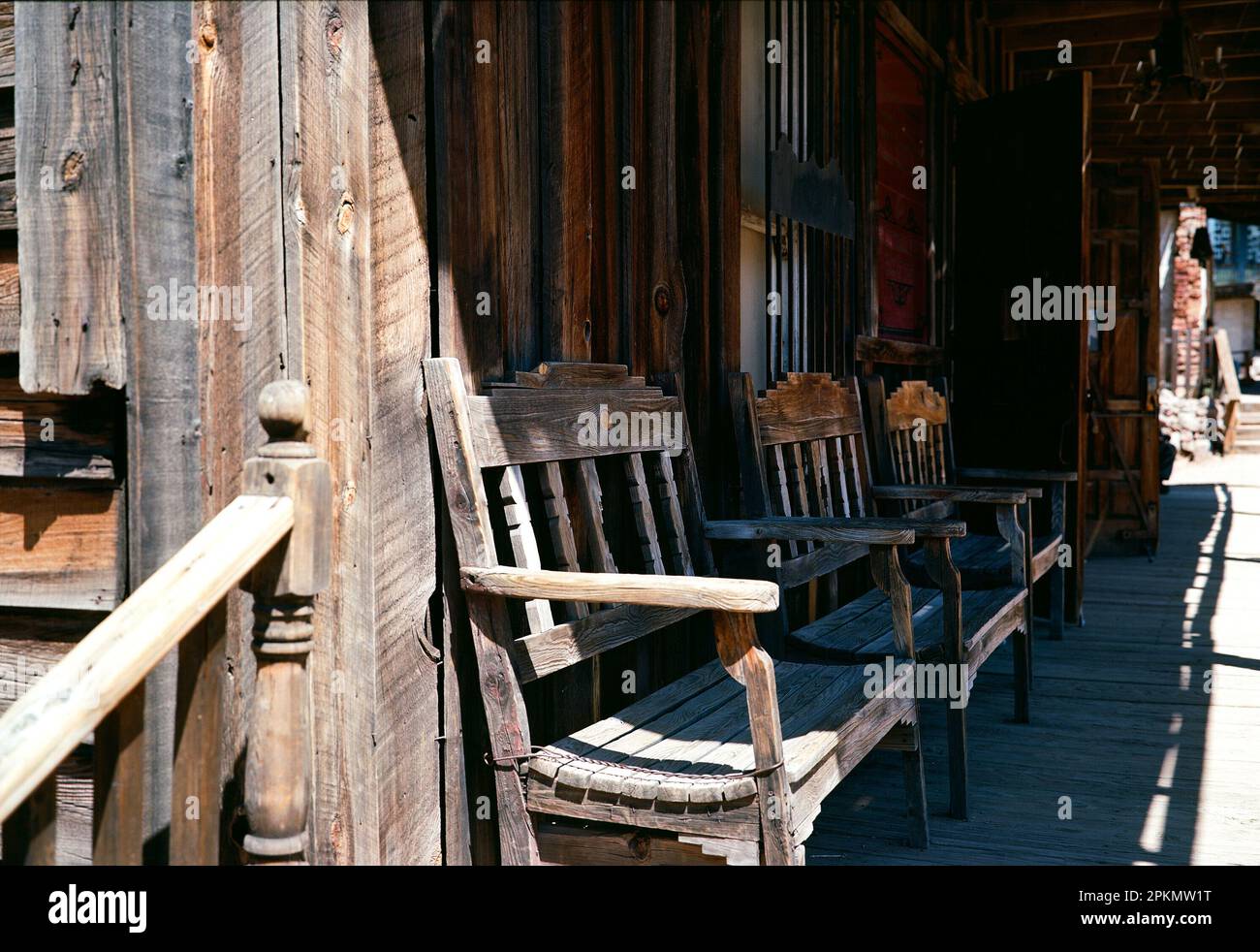 Weathered rural wooden benches on front porch Stock Photo - Alamy