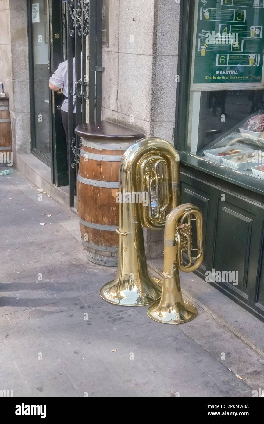 Two trombones left outside a bar before the procession. The procession ...