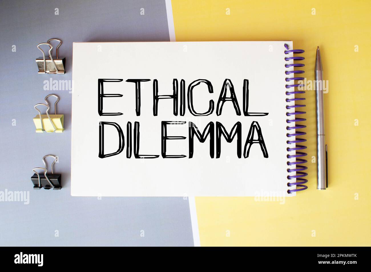 clipboard with white blank paper text ethical dilemma , calculator and ...