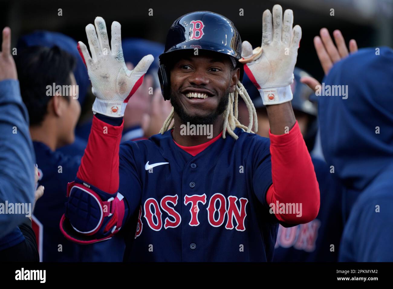 Boston Red Sox's Raimel Tapia is greeted in the dugout after a two-run ...