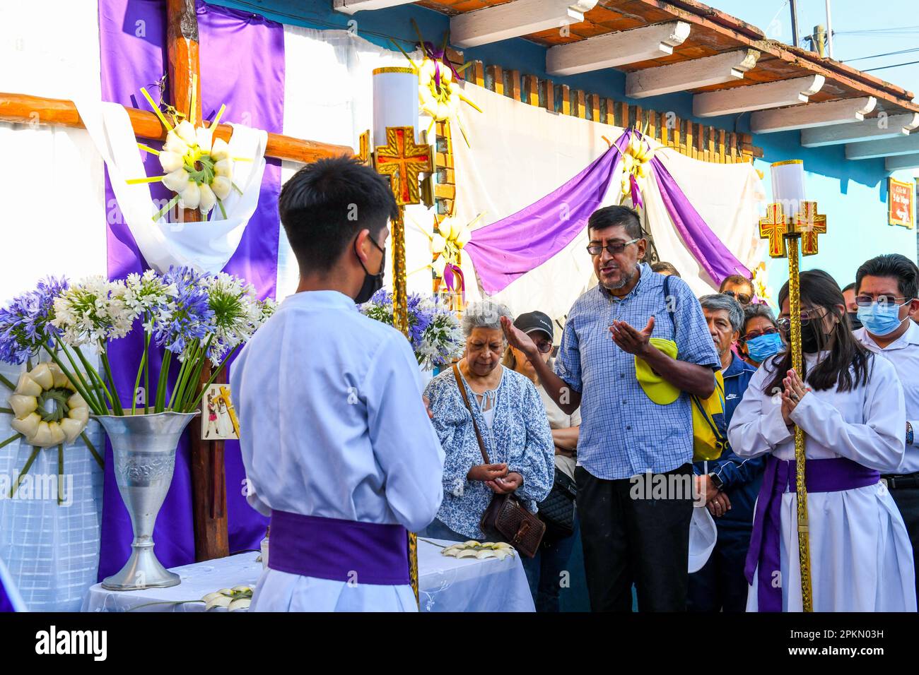 Parish members praying in front of neighbourhood altars during the Good ...