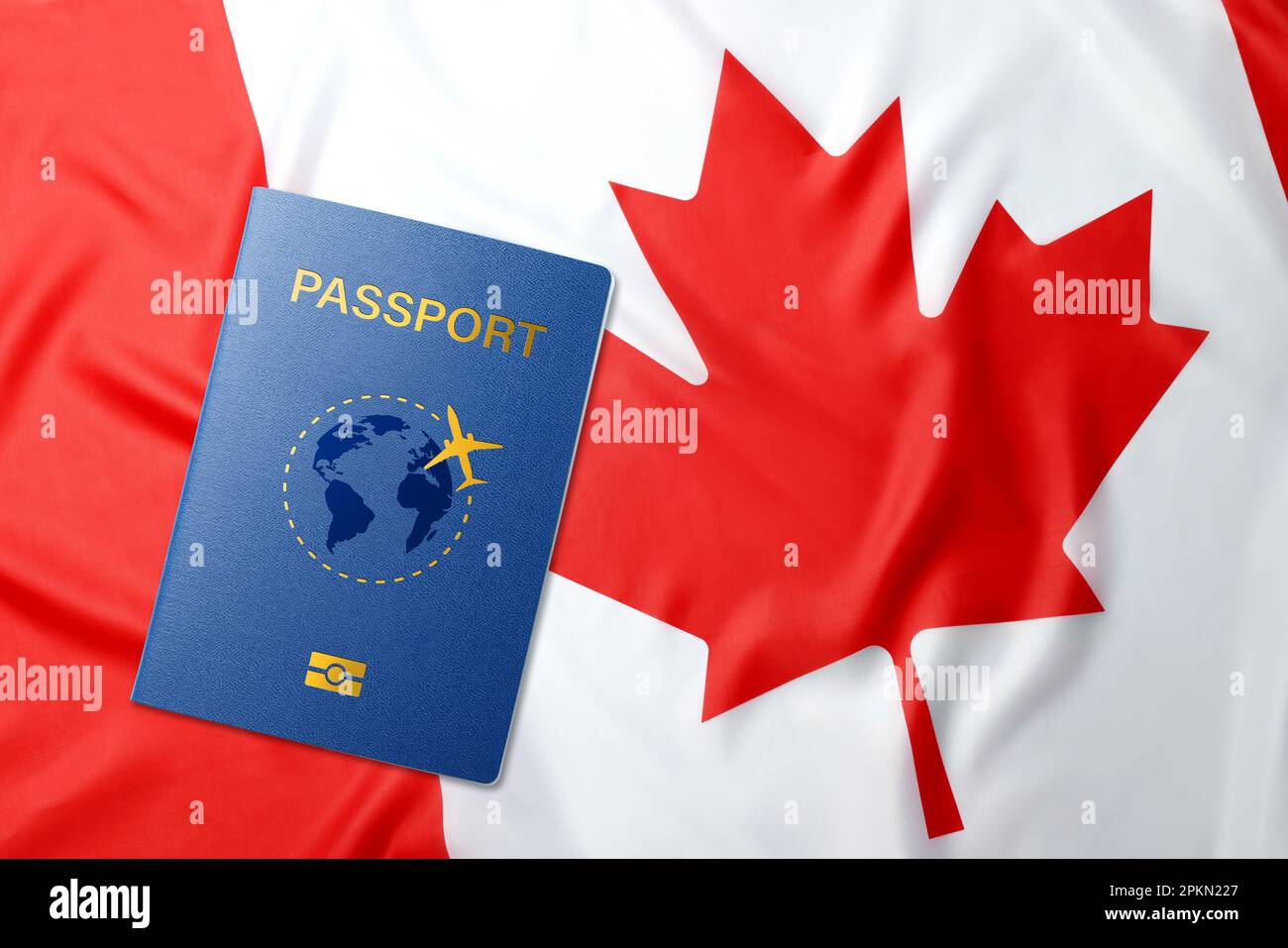Blue passport and flag of Canada, top view Stock Photo - Alamy