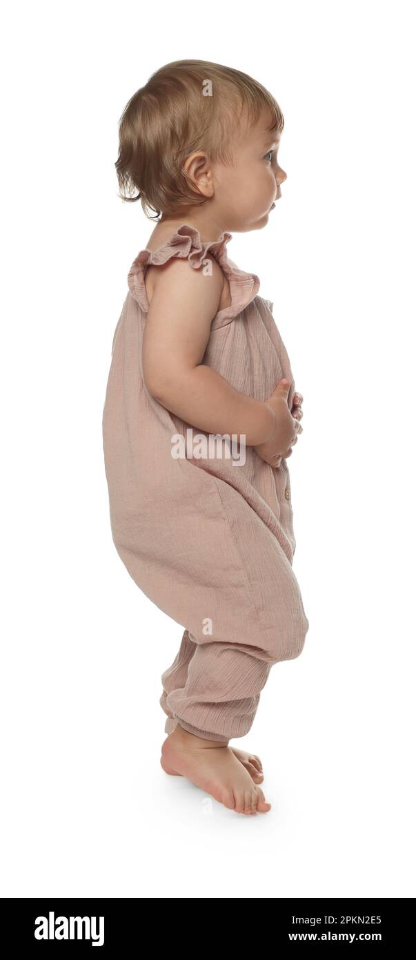 Cute baby girl learning to walk on white background Stock Photo - Alamy