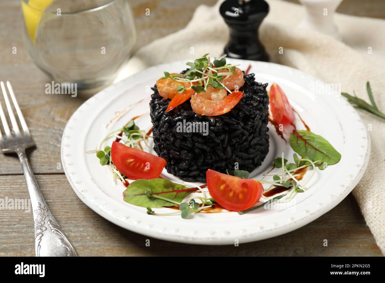 Delicious black risotto with seafood served on plate Stock Photo - Alamy