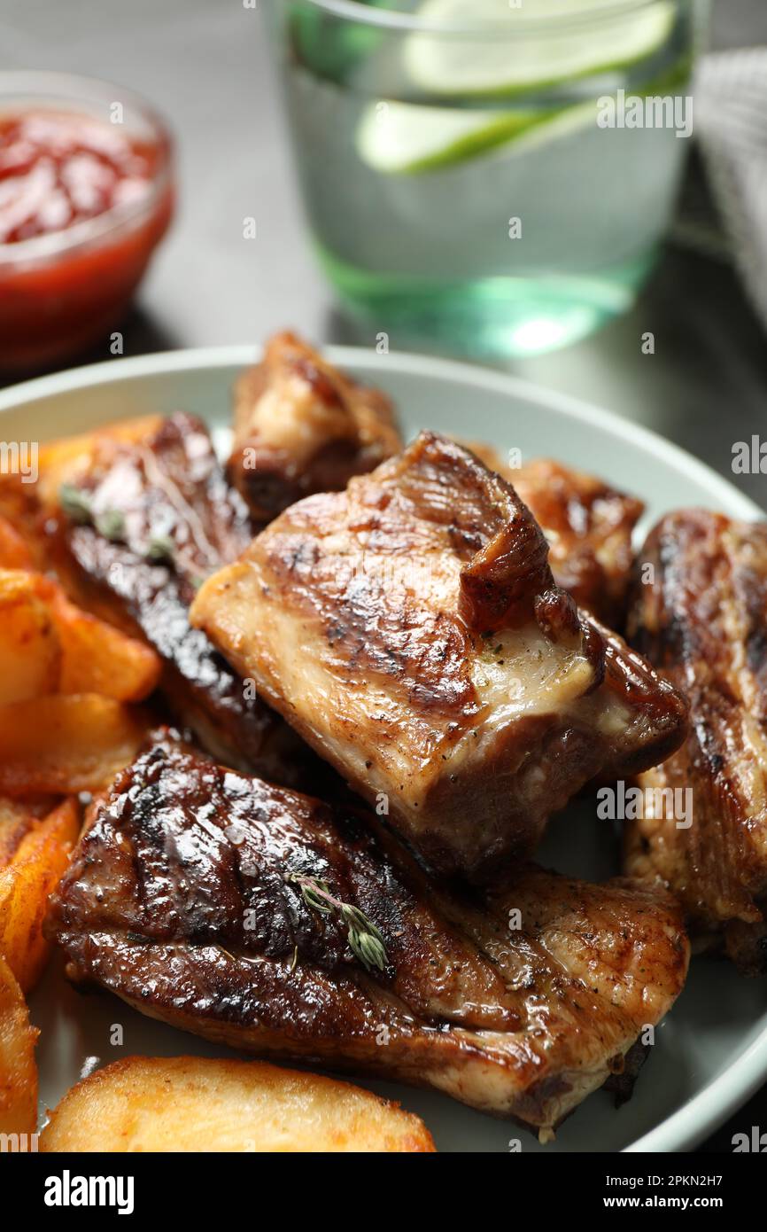 Delicious grilled ribs on table, closeup view Stock Photo - Alamy