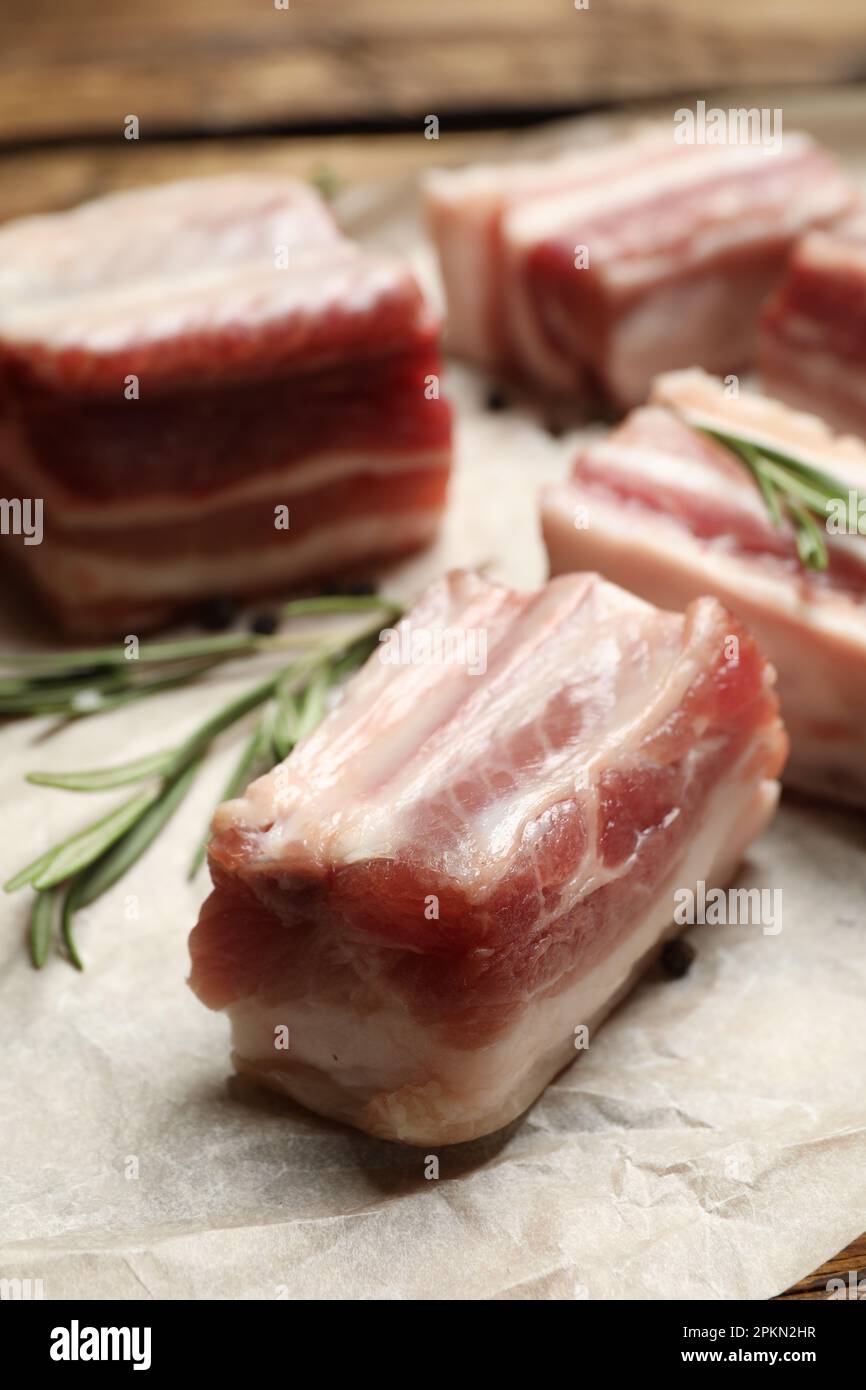 Raw ribs with rosemary on parchment paper, closeup Stock Photo - Alamy