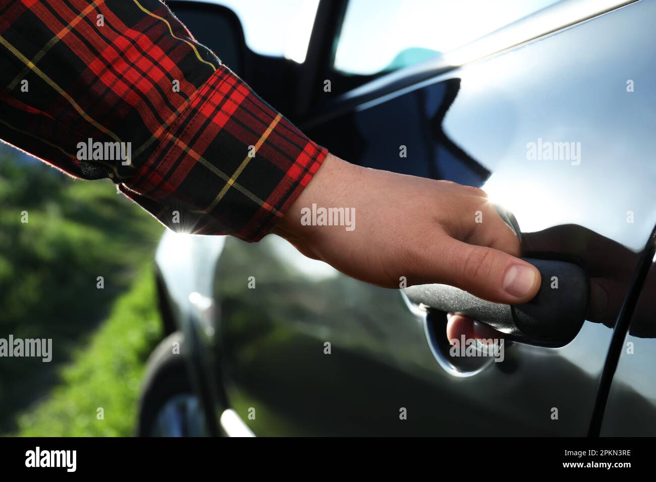 Closeup view of man opening car door Stock Photo - Alamy