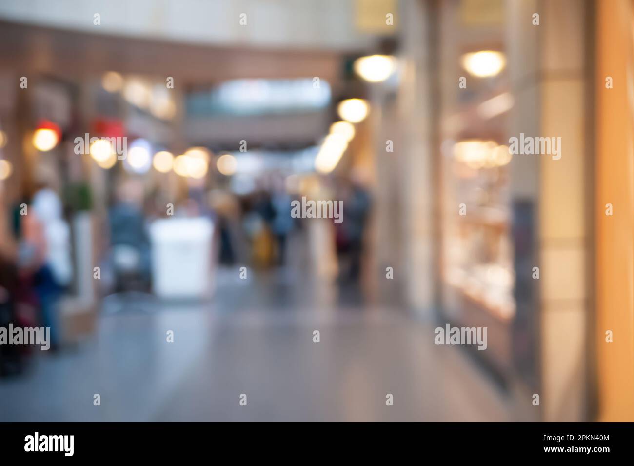 Blurred view of shopping mall with different stores, bokeh effect Stock ...