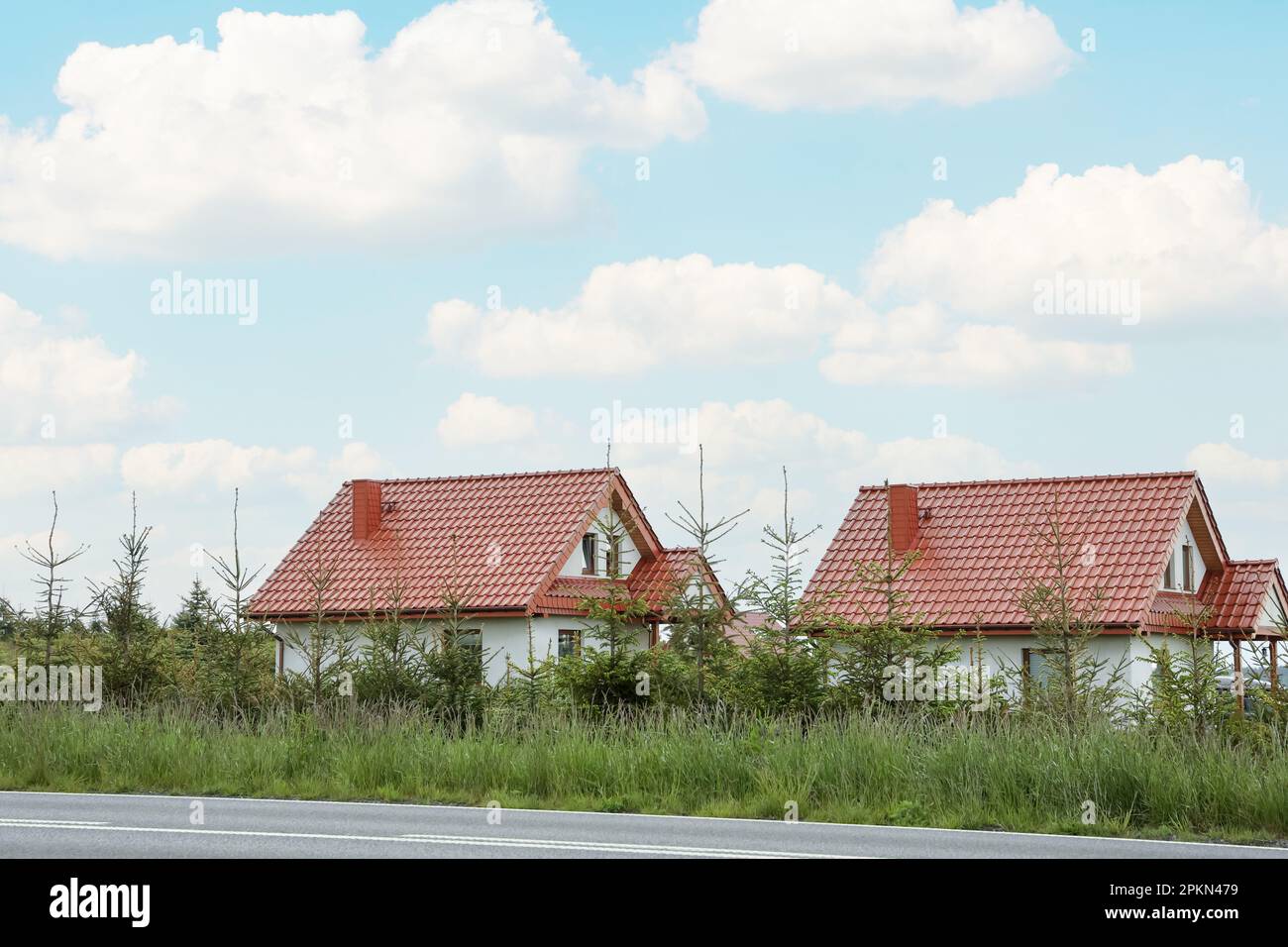 Modern buildings with red roofs outdoors on spring day Stock Photo - Alamy