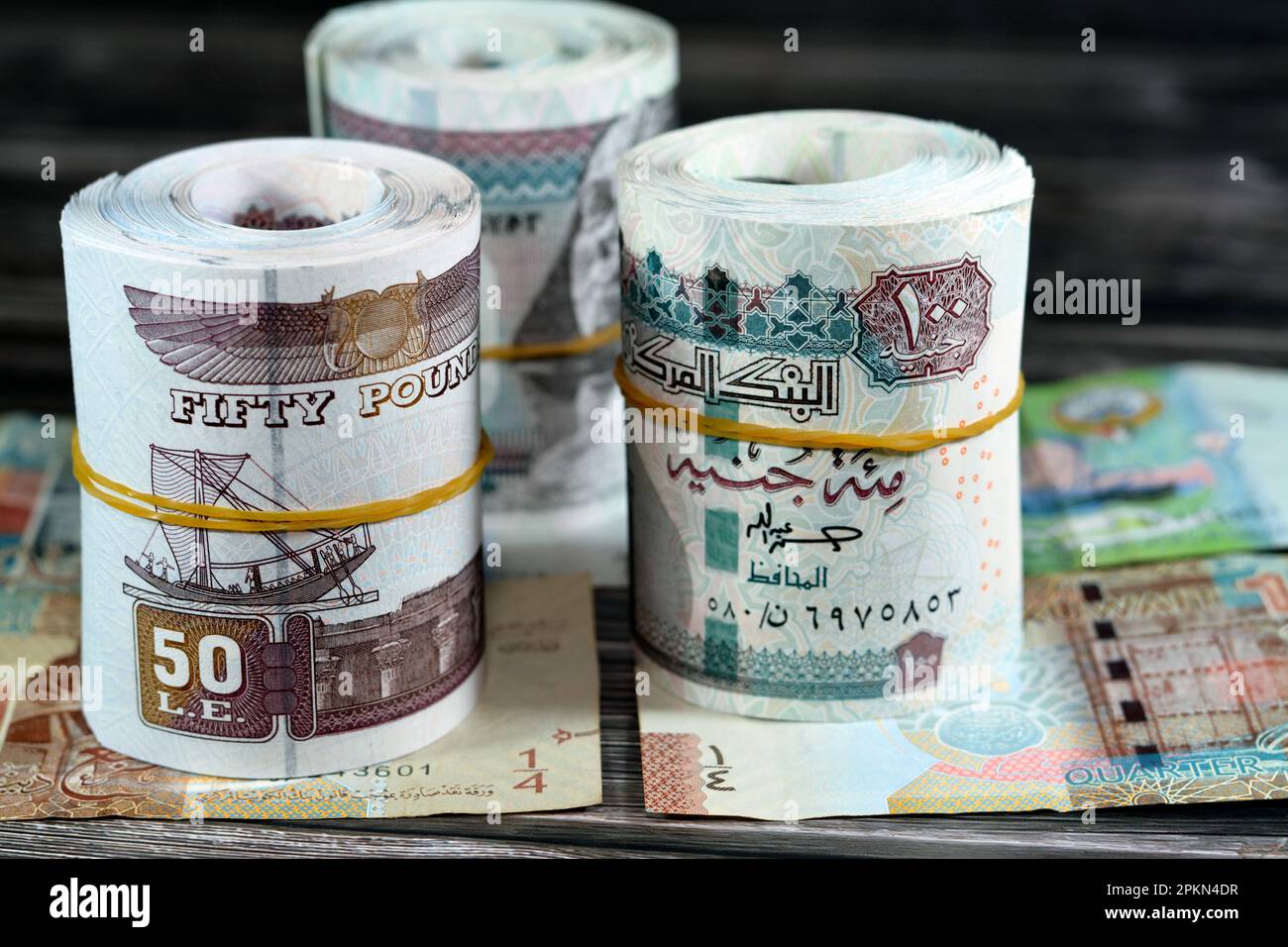 Rolls of Egypt money banknote bills of 100 and 50 EGP LE one hundred ...