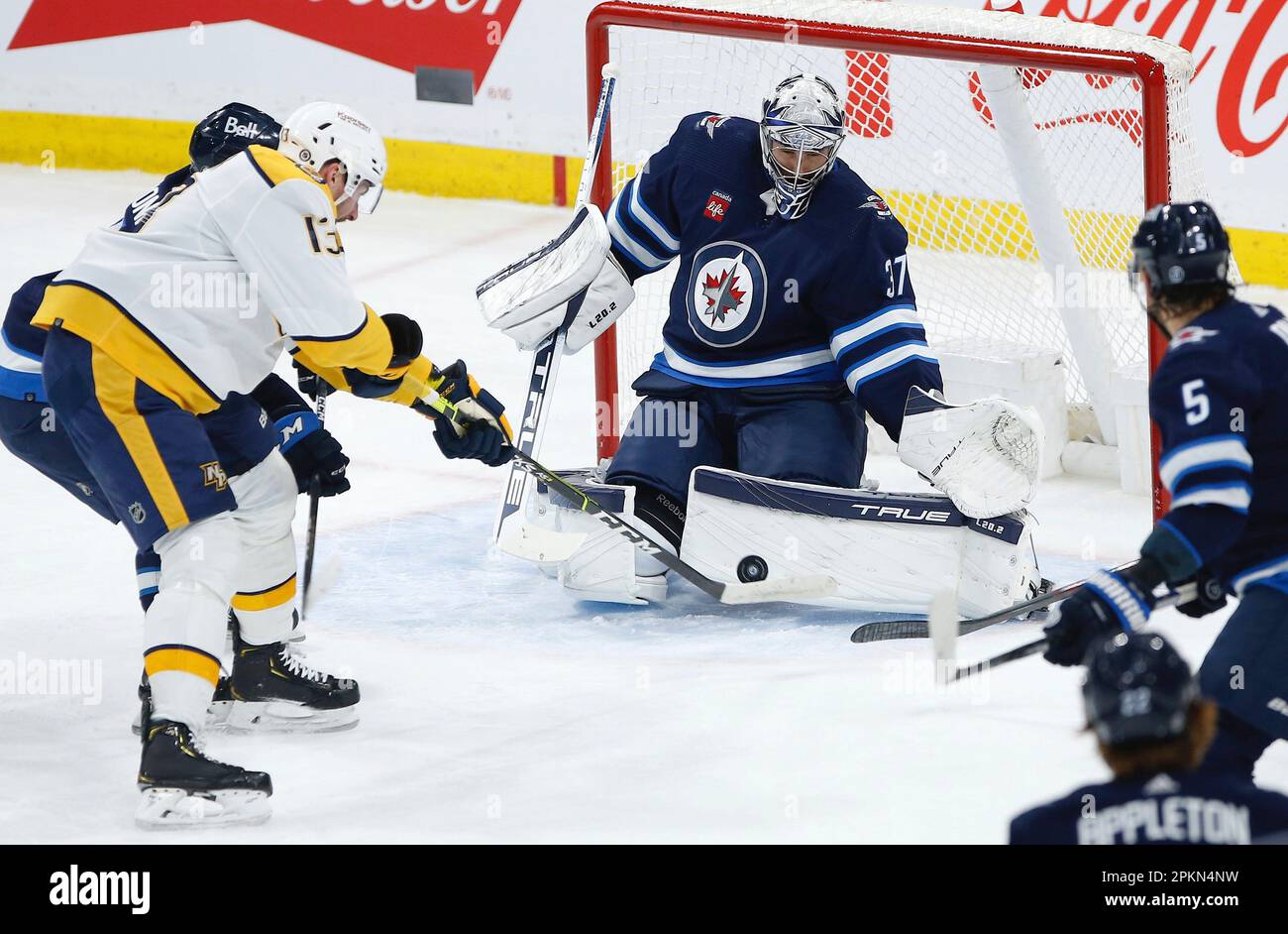 Winnipeg Jets goaltender Connor Hellebuyck (37) saves the shot by ...