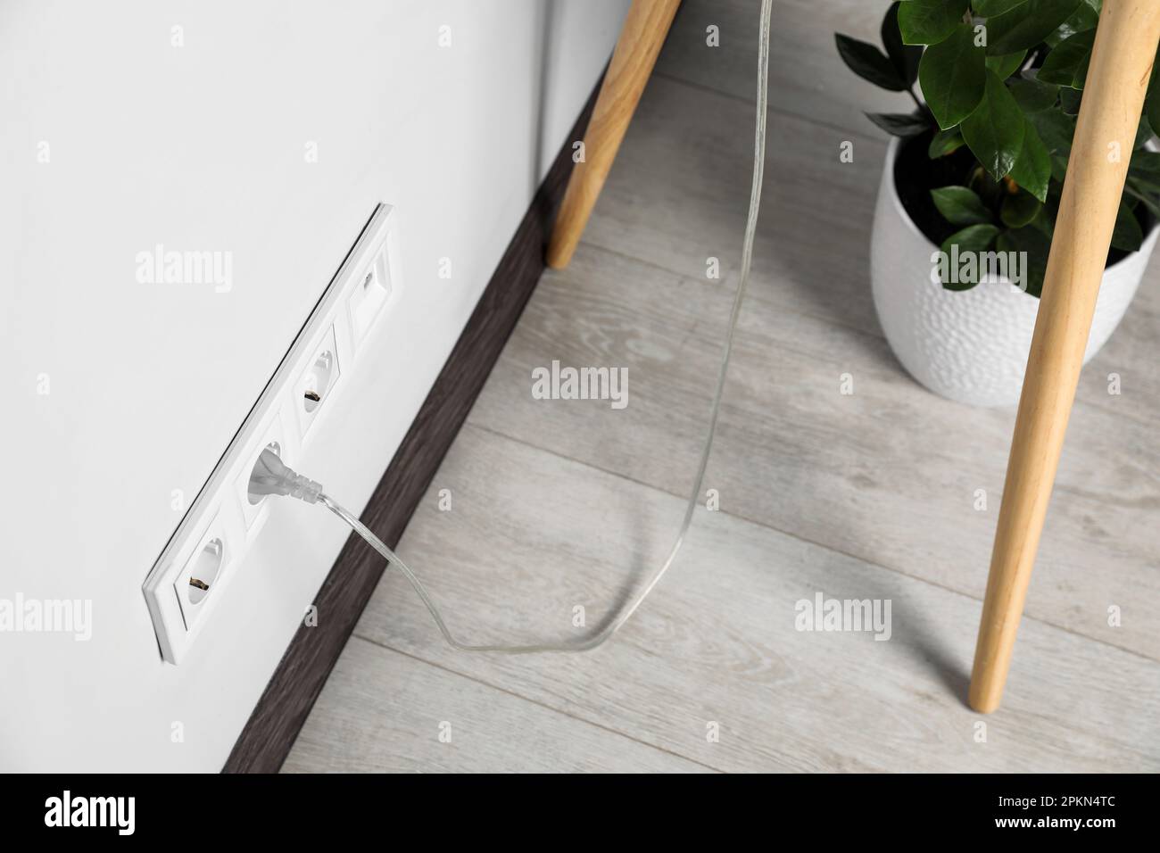 Power socket and plug on wall indoors. Electrician's equipment Stock ...