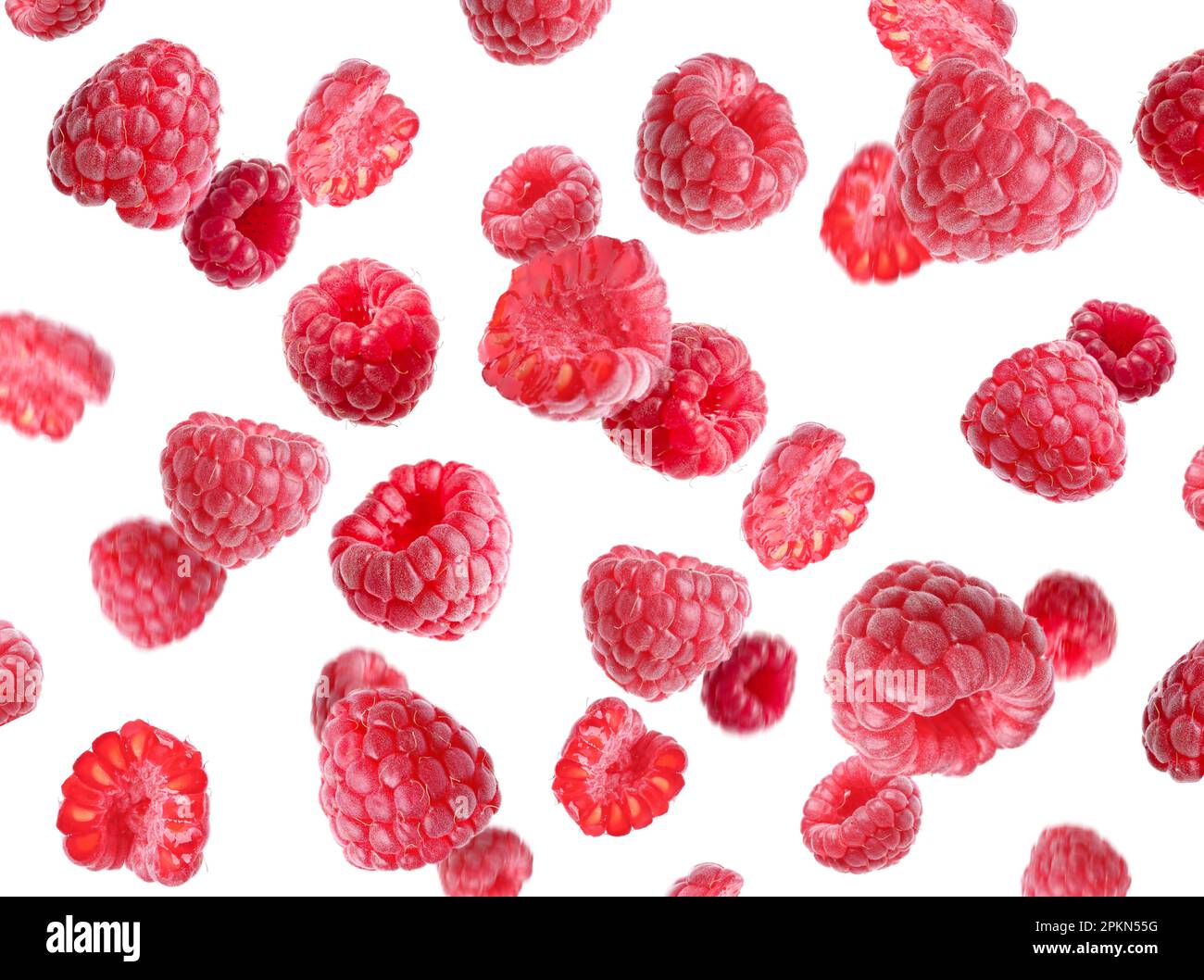 Delicious ripe raspberries flying on white background Stock Photo - Alamy