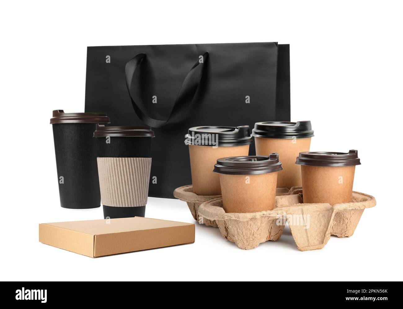 Set with different takeaway cups and paper bag on white background ...