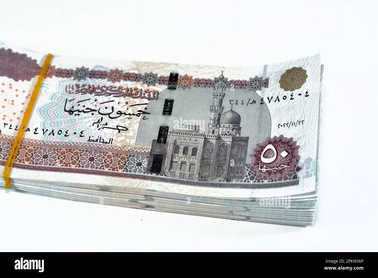 Egypt money stack of pounds isolated on wood background, pile of 50 EGP ...