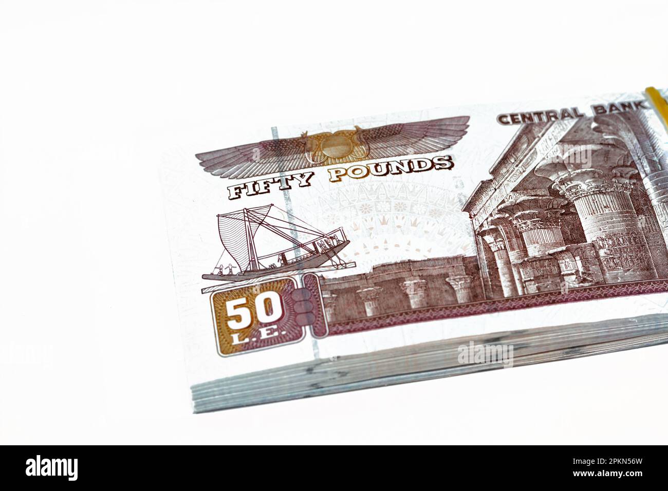 Egypt money stack of pounds isolated on wood background, pile of 50 EGP ...