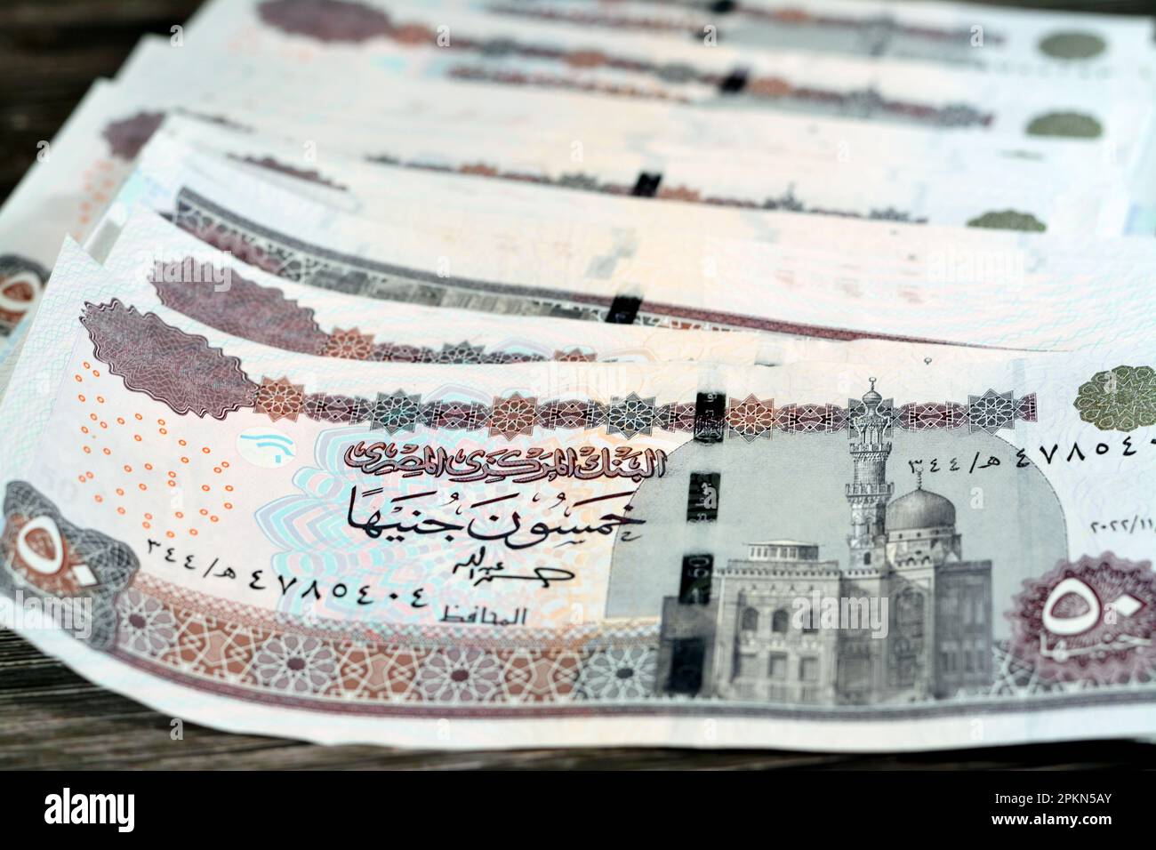 Egypt money stack of pounds isolated on wood background, pile of 50 EGP ...