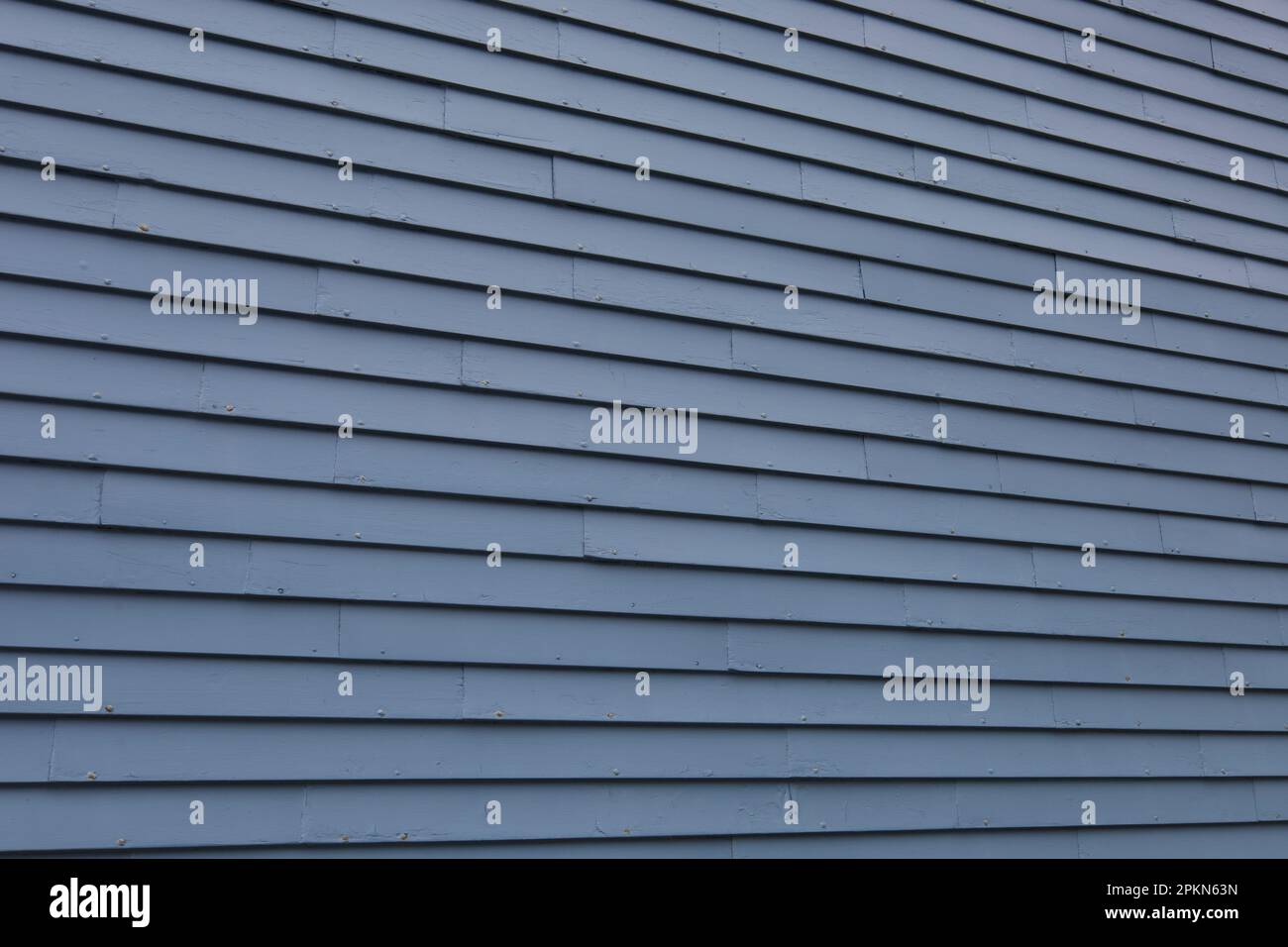 Blue wooden siding of vintage home from 1700s in Newport, Rhode Island ...