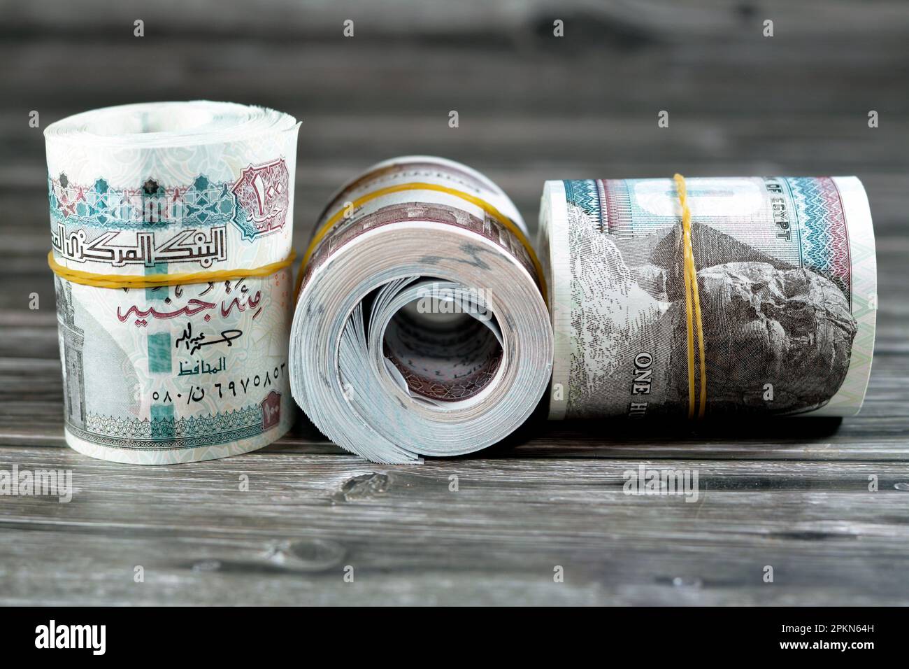 Rolls of Egypt money banknote bills of 100 and 50 EGP LE one hundred ...