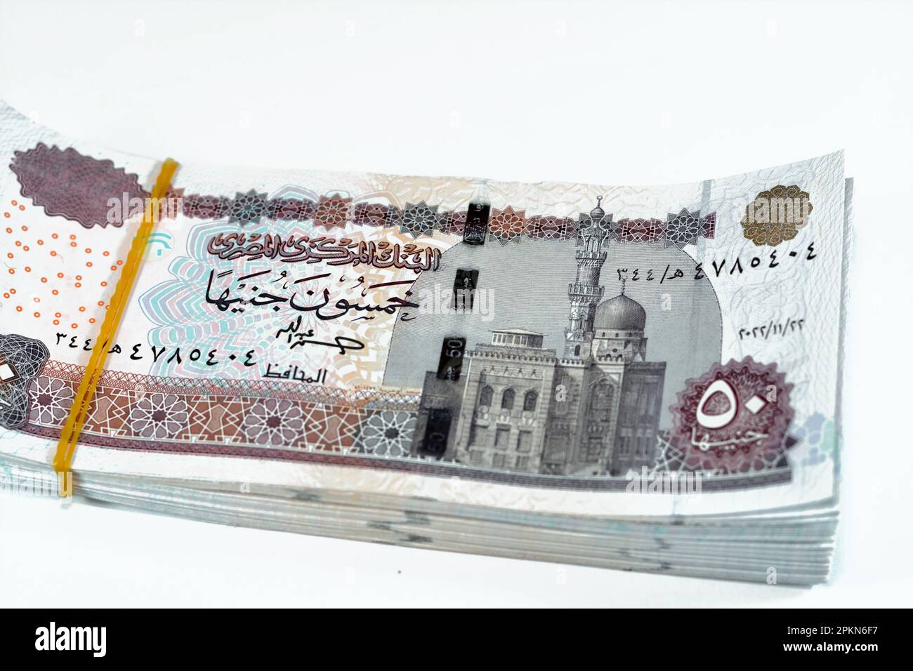 Egypt money stack of pounds isolated on wood background, pile of 50 EGP ...