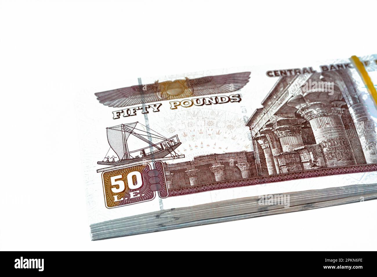 Egypt money stack of pounds isolated on wood background, pile of 50 EGP ...