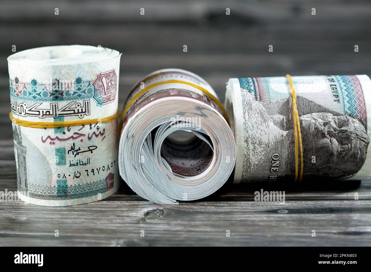 Rolls of Egypt money banknote bills of 100 and 50 EGP LE one hundred ...