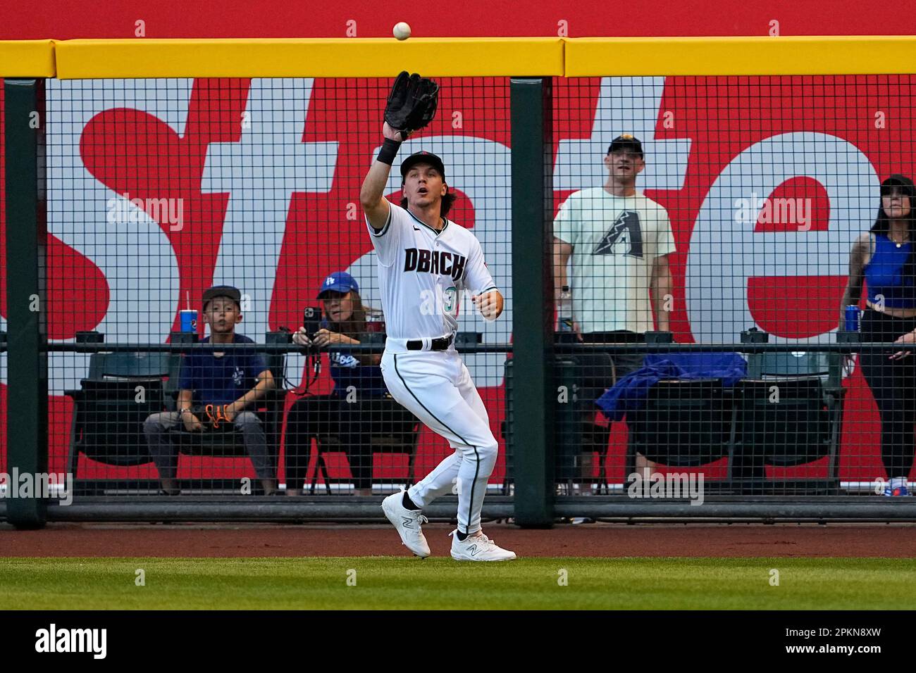 Arizona Diamondbacks' Jake McCarthy fields a fly-out hit by Los Angeles ...